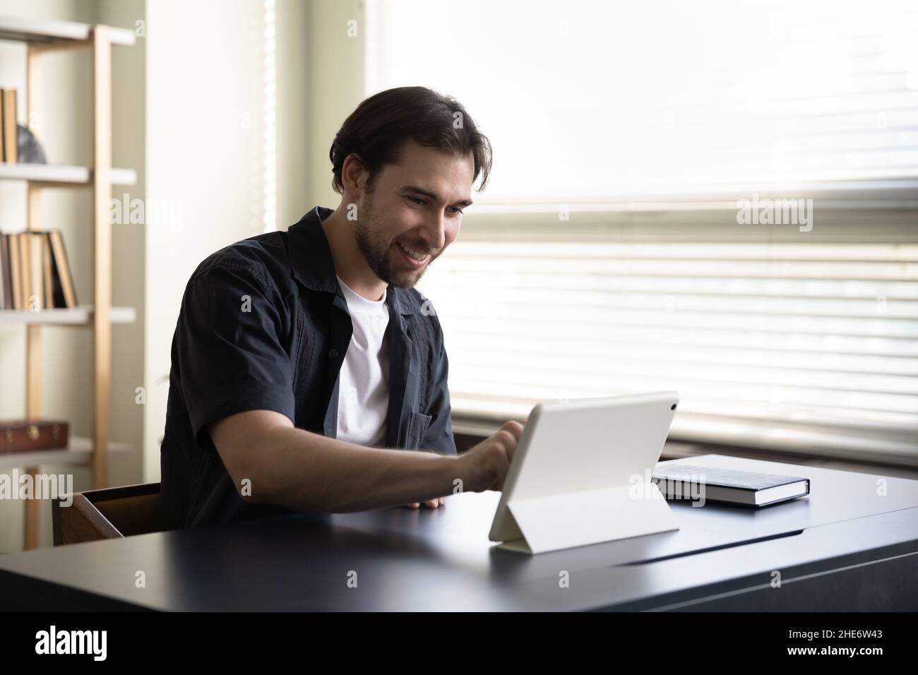 Happy young businessman using digital computer tablet Stock Photo - Alamy
