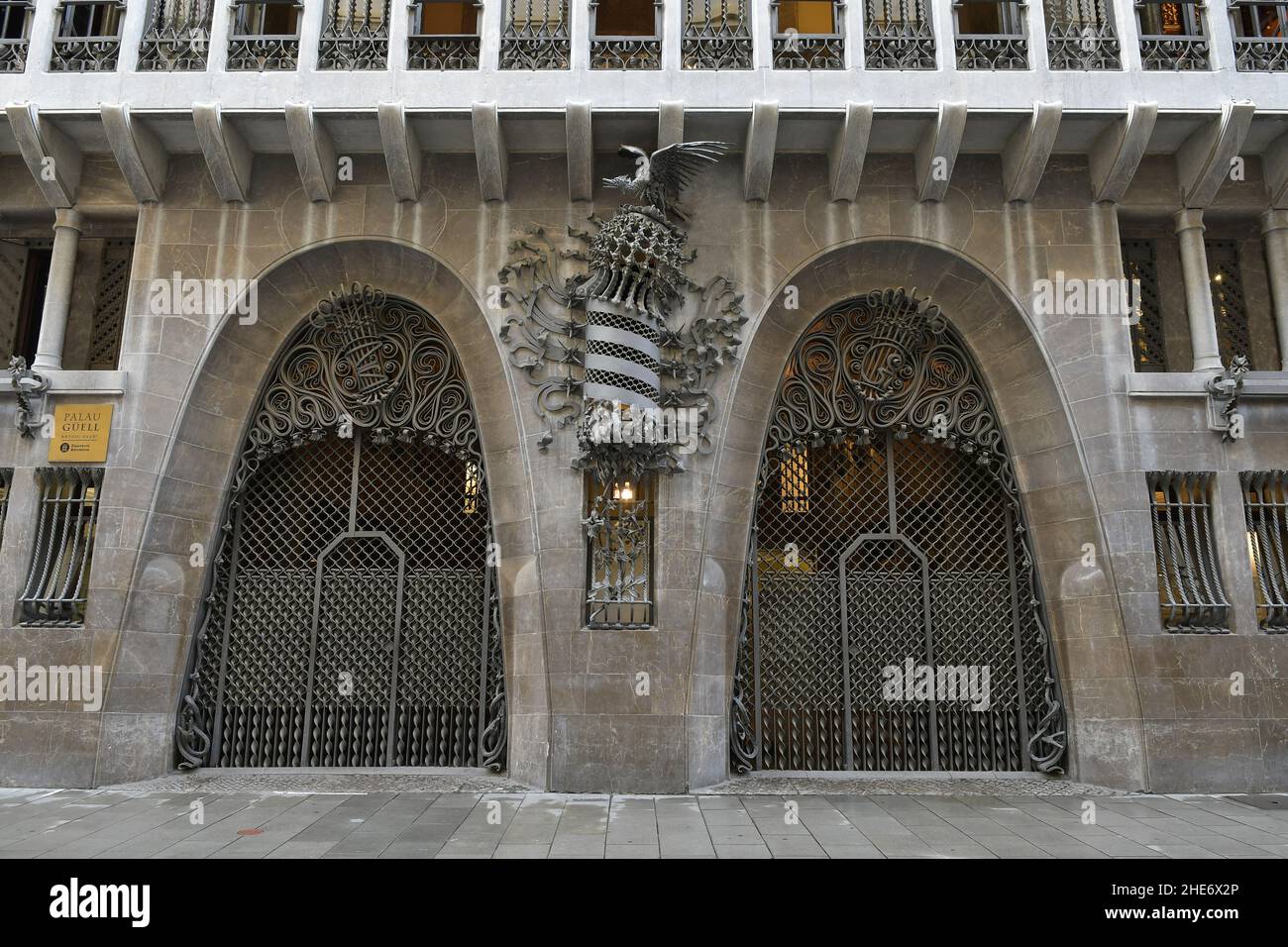 Palau Güell - modernist mansion front facade with arched gates ...