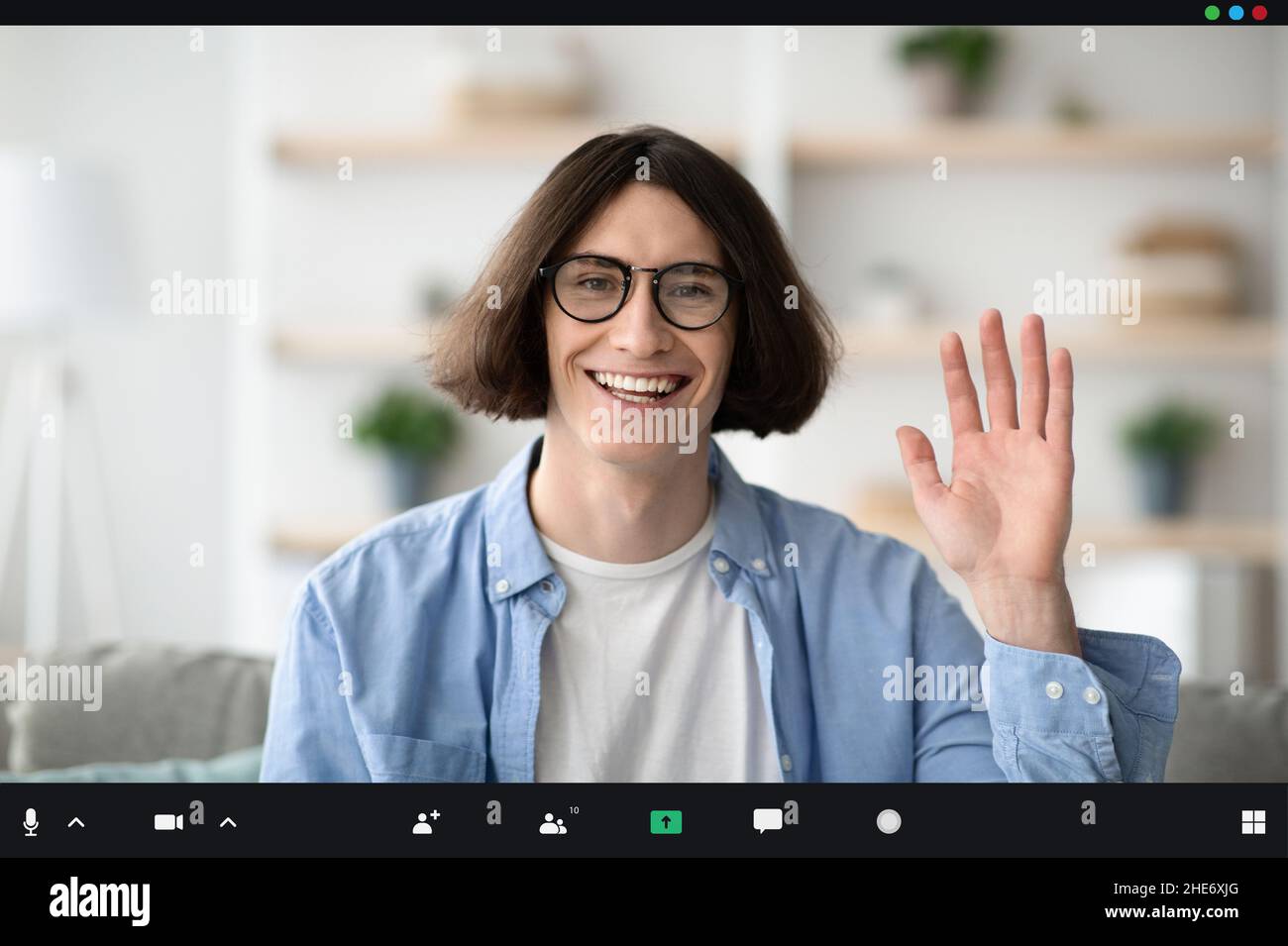 Web conference. Happy guy making video call via laptop and gesturing ...