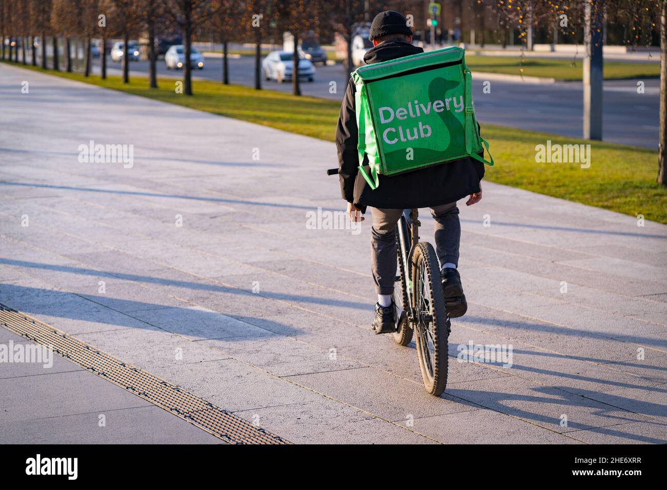 Krasnodar, Russia - January 7 2022: Food delivery boy ride on a bicycle ...