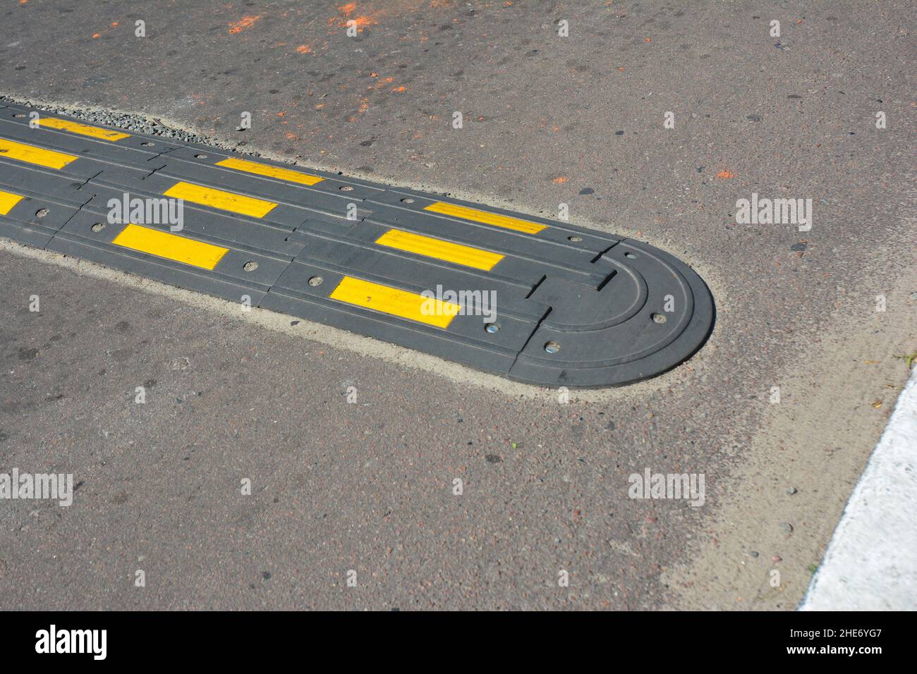 Traffic safety speed bump on an asphalt road. Speed bumps (or speed ...