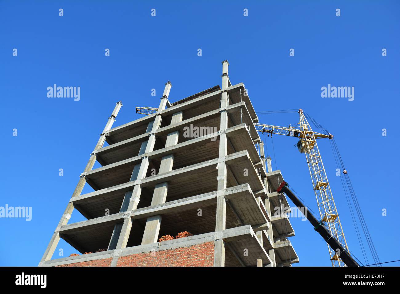 Crane Building New House on the Construction Site. Industrial Building ...
