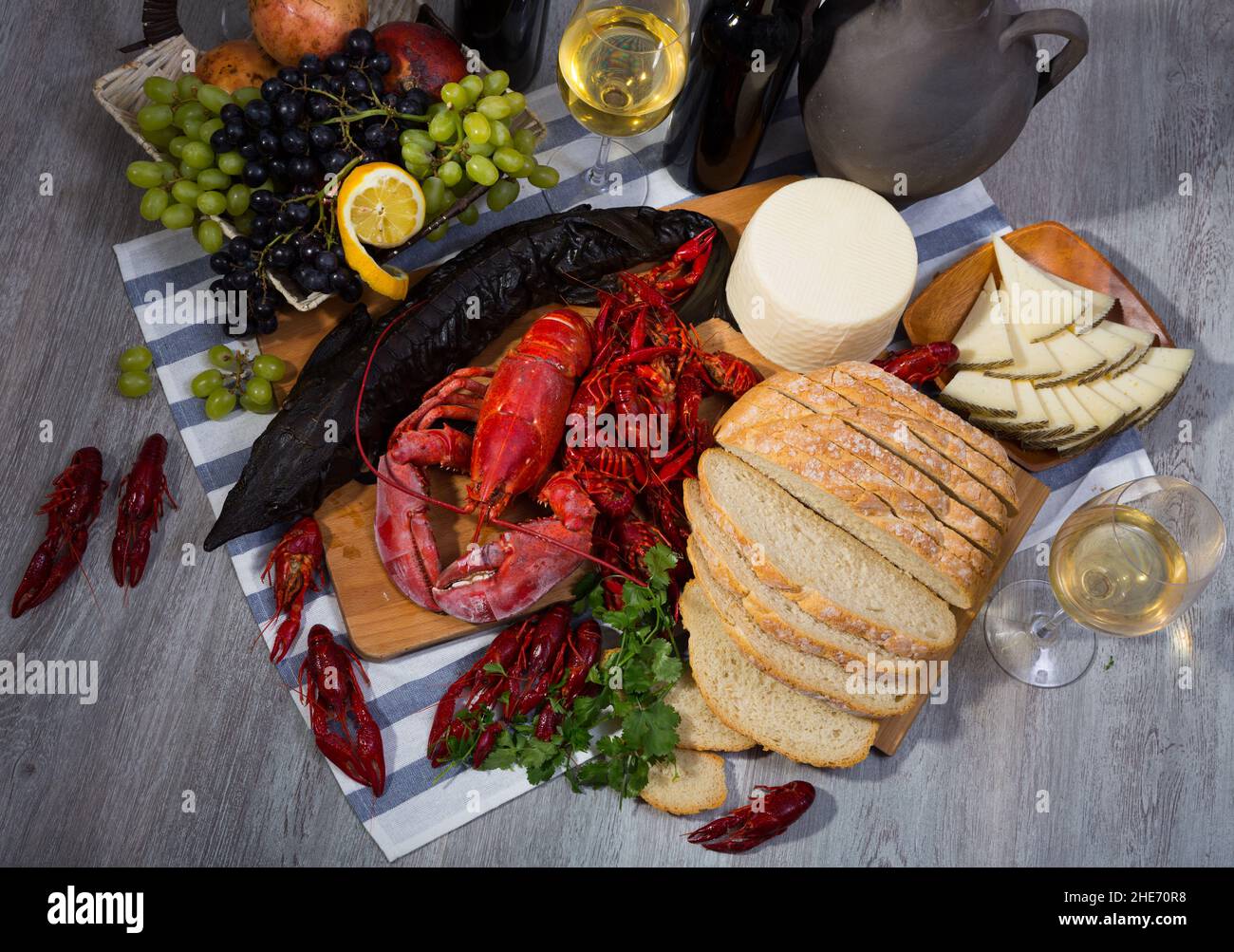 Still life with cooking marine products, wine and cheese Stock Photo ...
