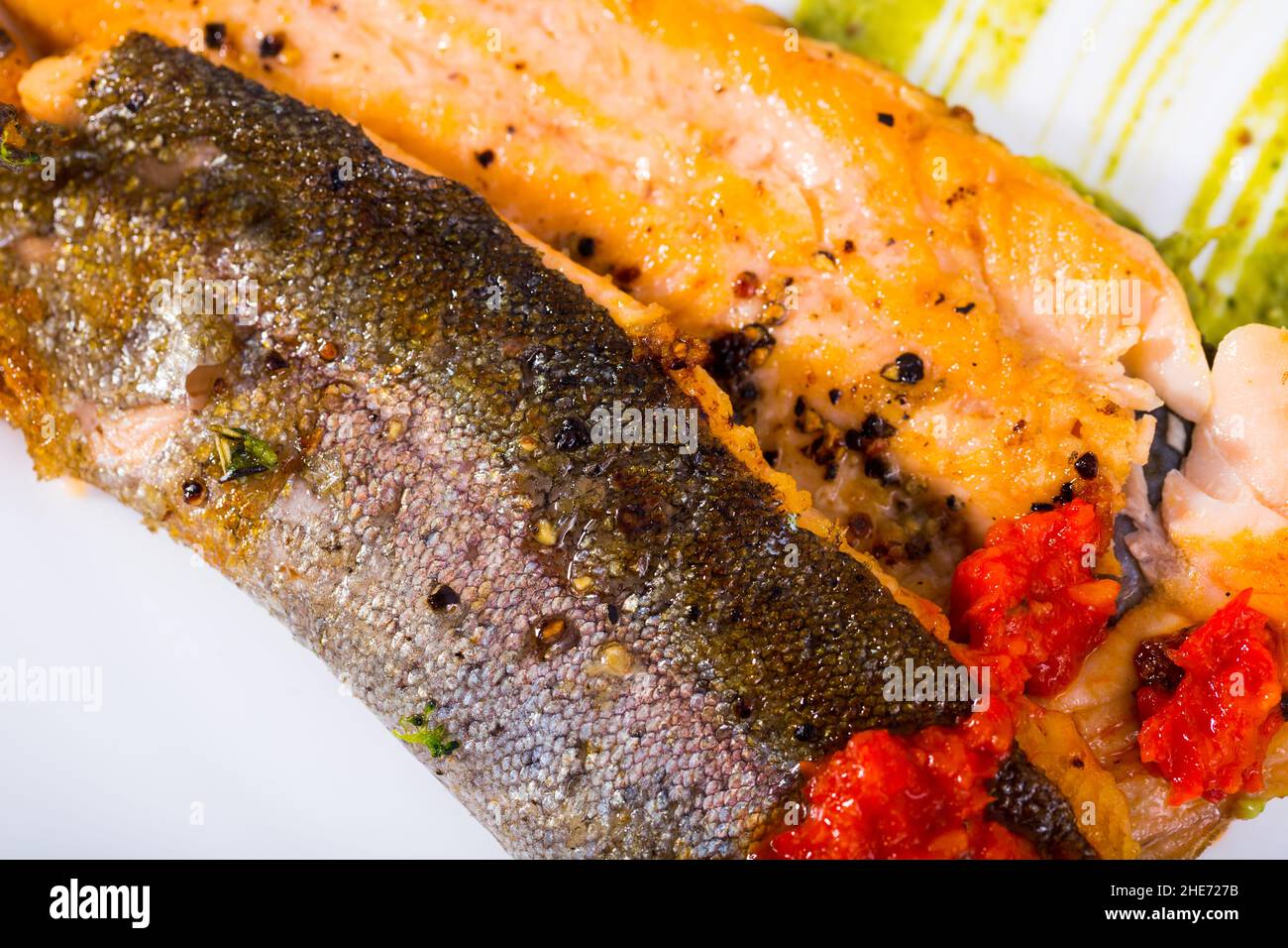 Fried trout fillets with sauces Stock Photo - Alamy