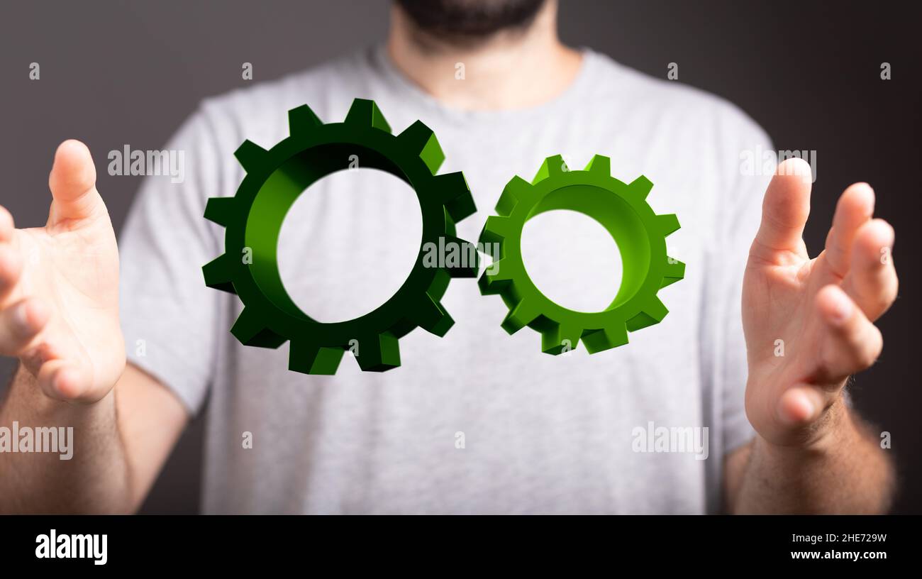 3d rendering of man touching mechanism, green metallic gears, and cogs ...