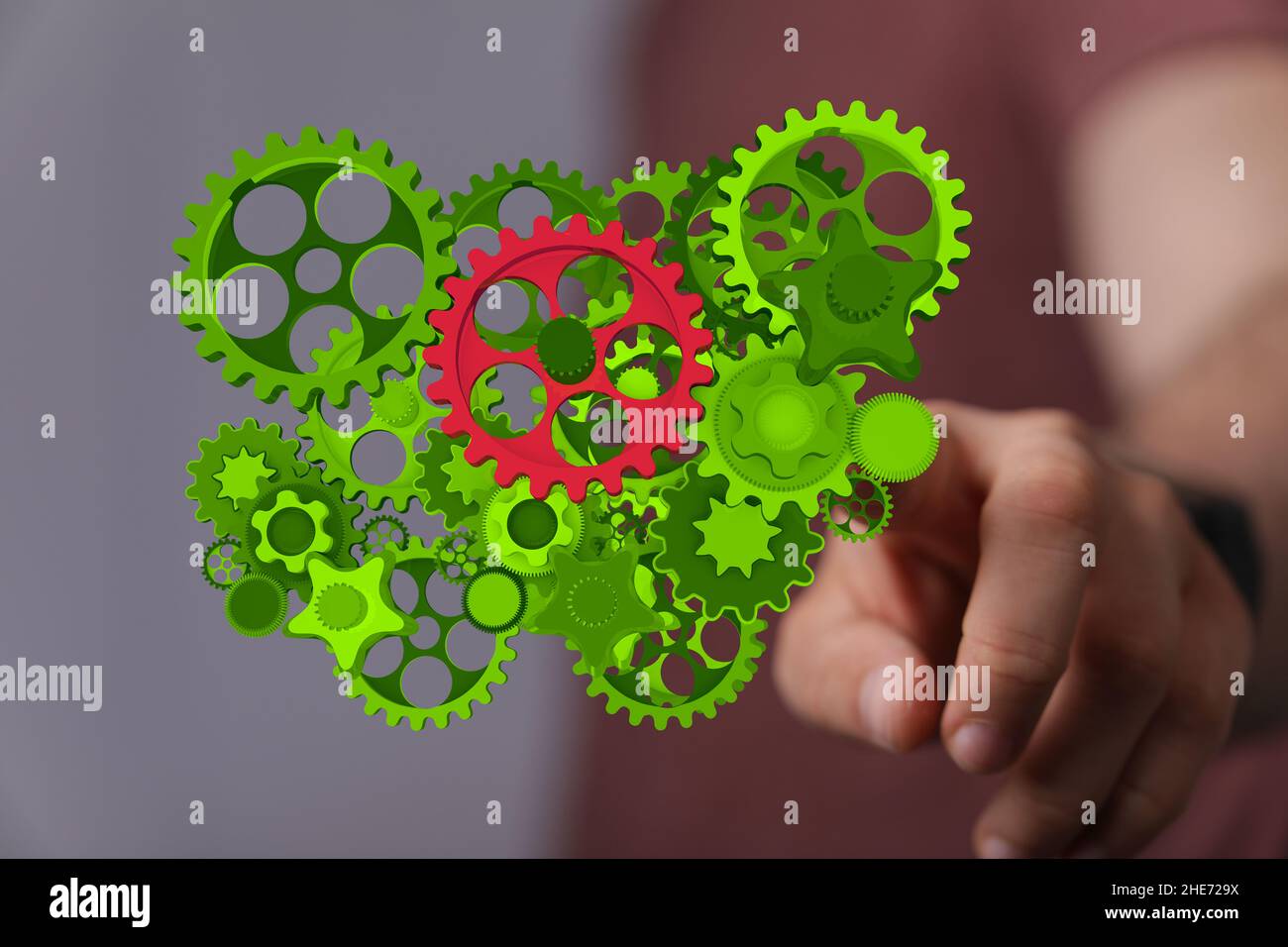 3d rendering of man touching mechanism, green metallic gears, and cogs ...