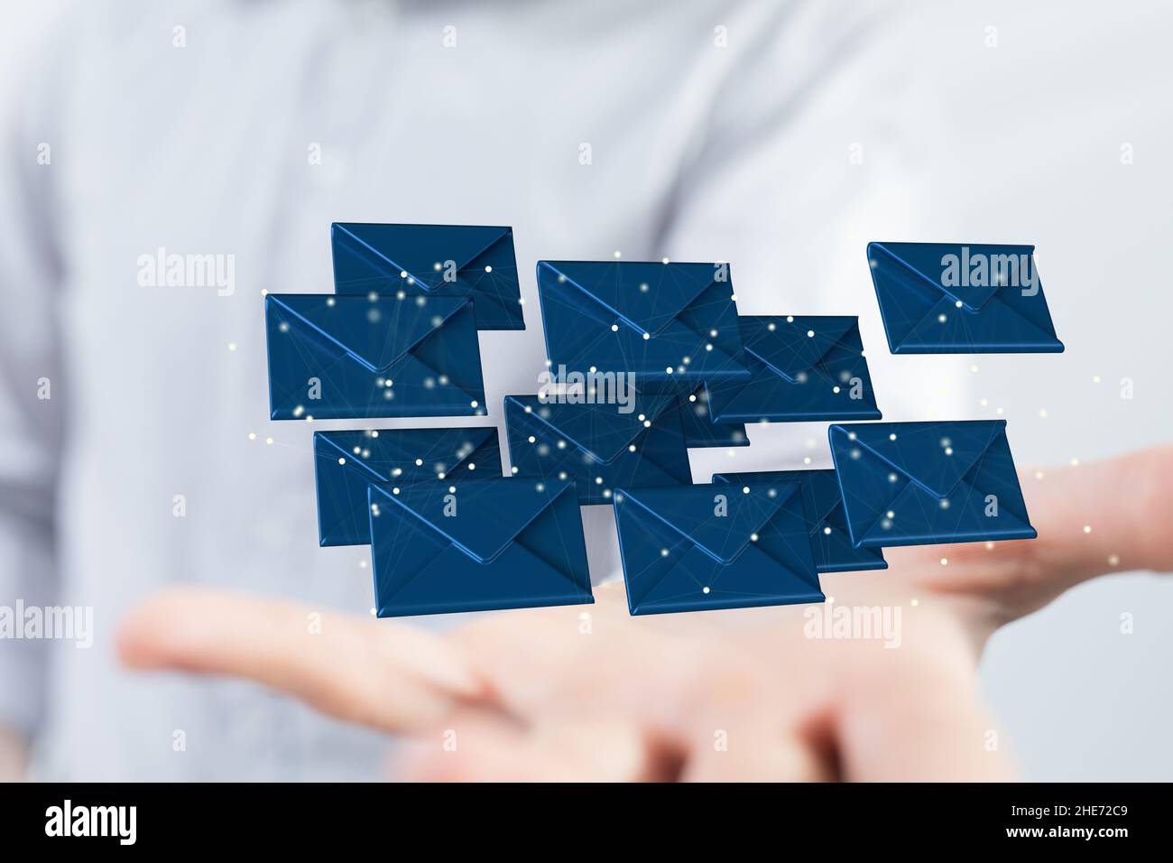Rendering of flying email icons in human's hand Stock Photo - Alamy