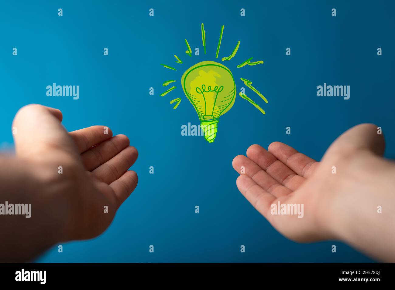 3d rendering of hands holding green light bulb symbol Stock Photo - Alamy