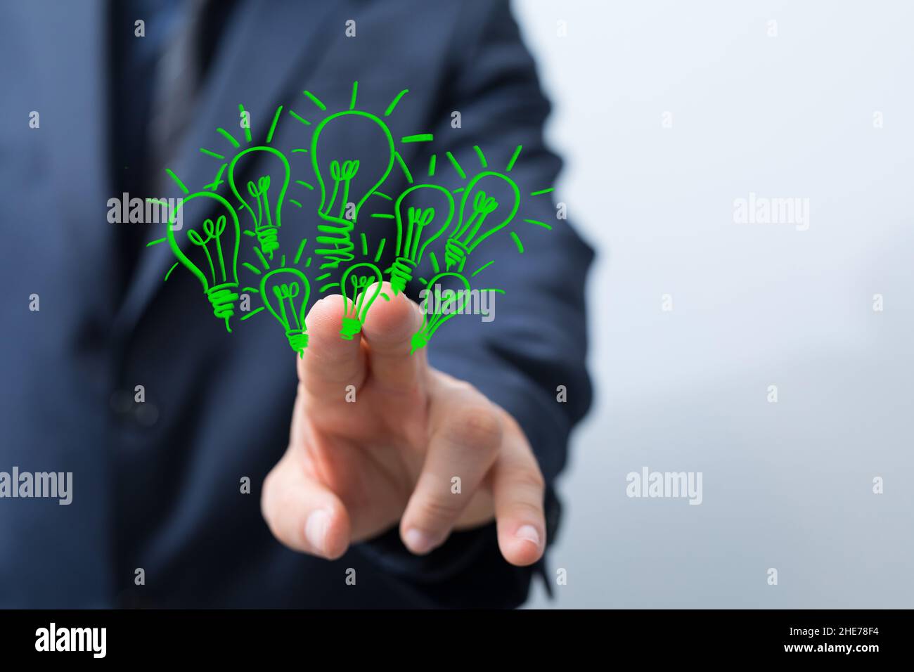 3d rendering of hands holding green light bulb symbols Stock Photo - Alamy