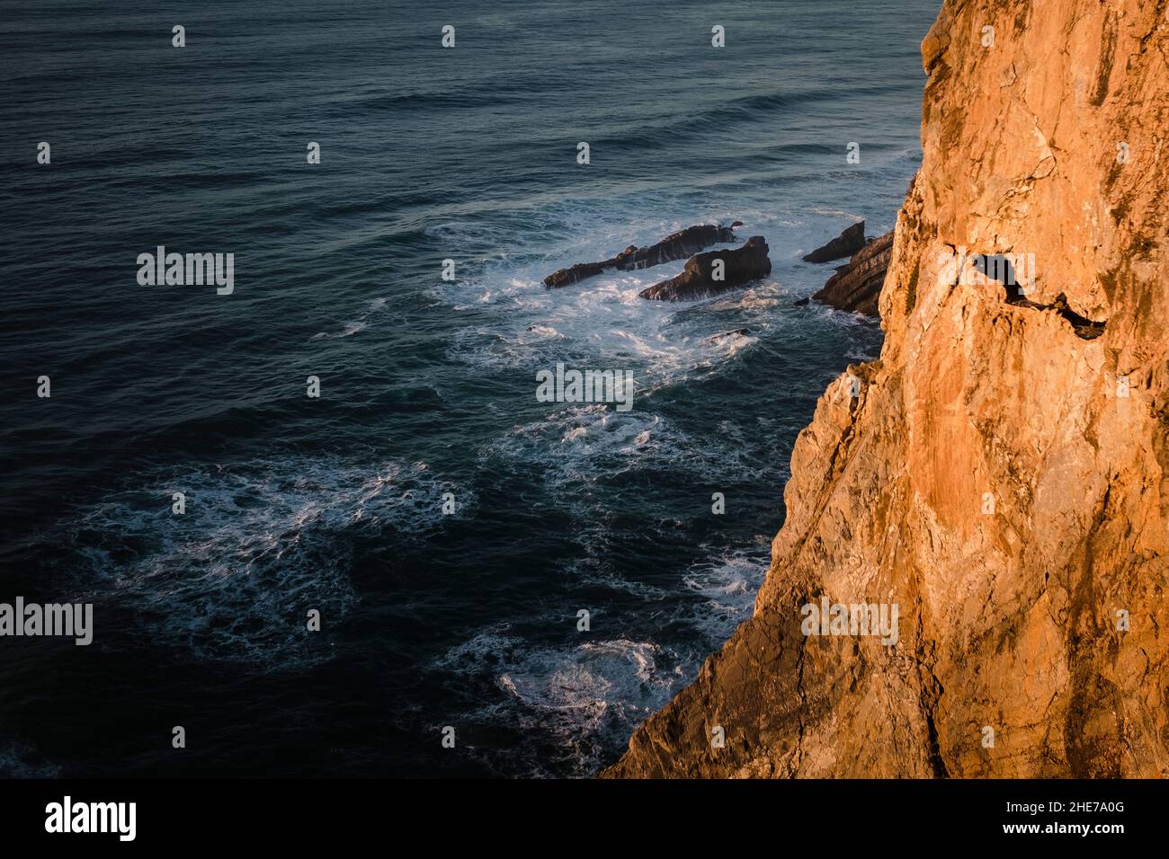 Rocks and ocean surf near the Portuguese lighthouse Cabo da Roca ...