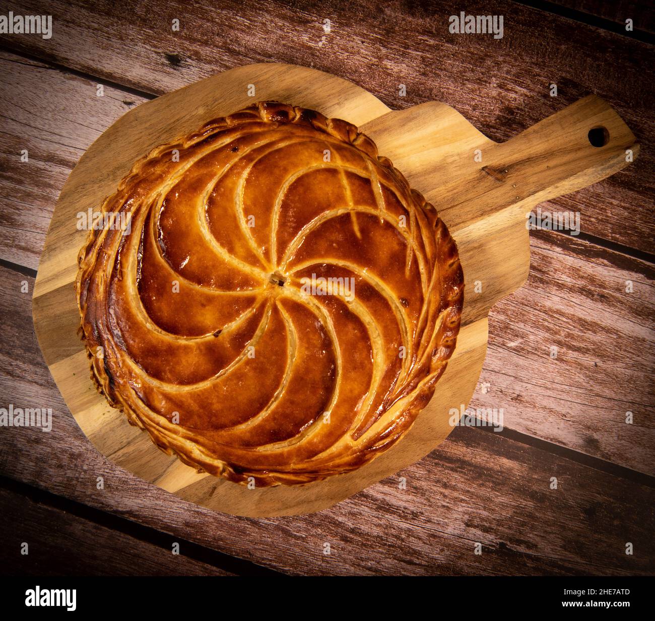 Galette des rois on wooden table, Traditional Epiphany cake in France ...