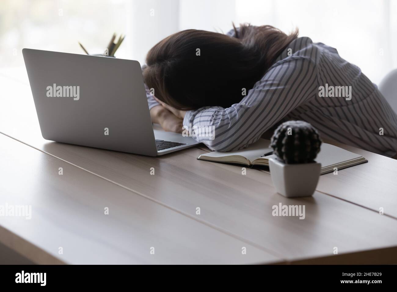Exhausted tired office worker, employee woman sleeping at workplace ...