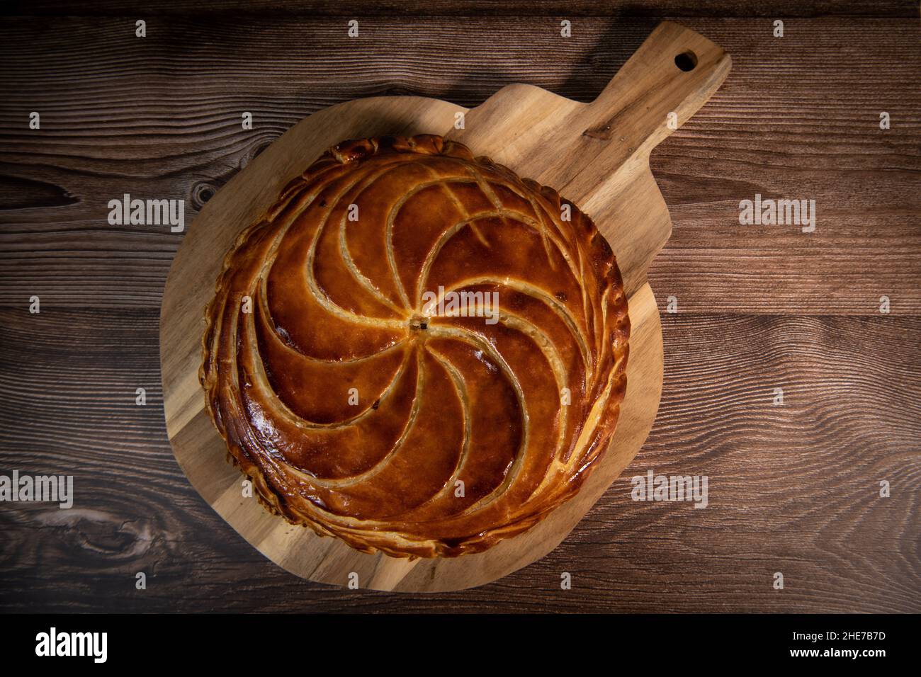 Galette des rois on wooden table, Traditional Epiphany cake in France ...