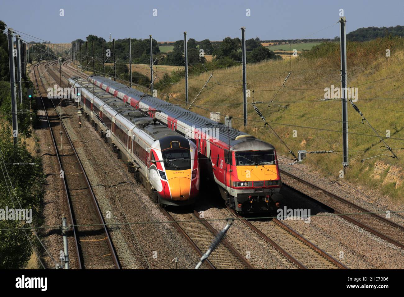 LNER Class 800 Azuma train passing 82212 DVT train, East Coast Main Line Railway, near Essendine ...
