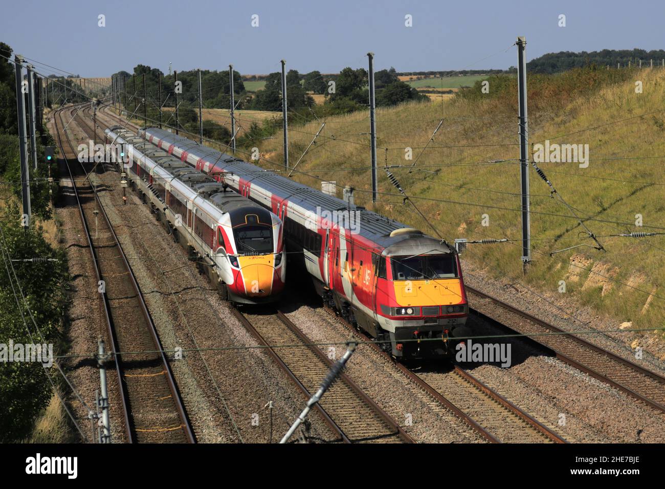 LNER Class 800 Azuma train passing 82212 DVT train, East Coast Main ...