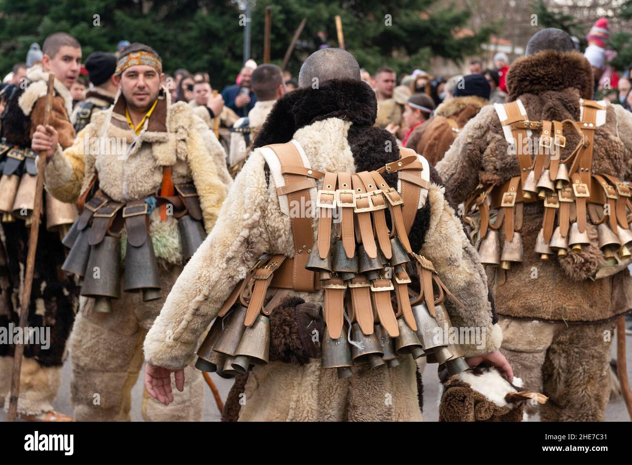 Kukeri dancers with intricate costumes, large bells and masks dancing ...