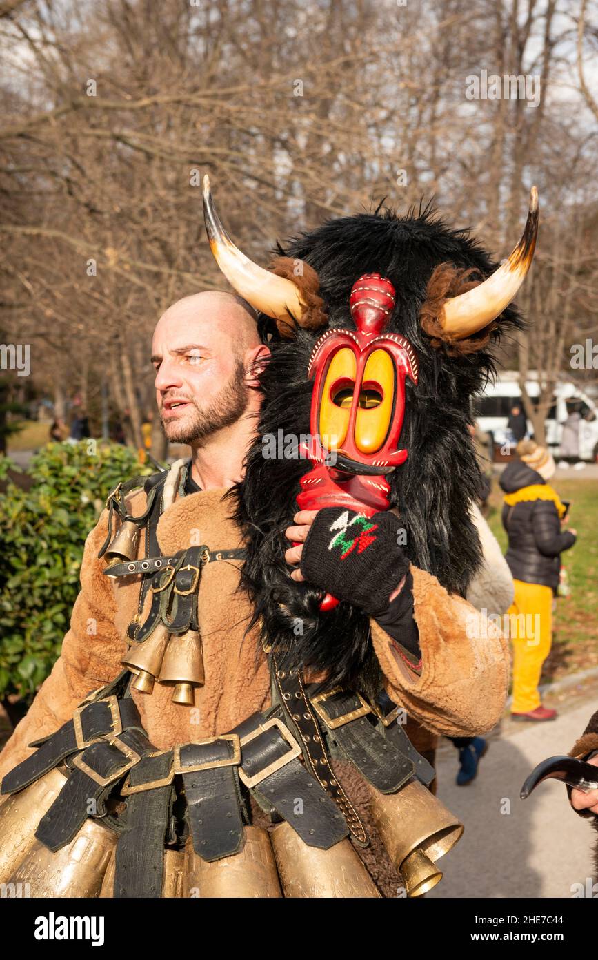 Kukeri dancers with intricate costumes, large bells and masks dancing ...