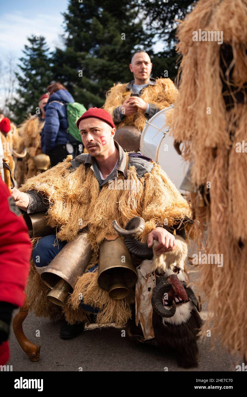 Kukeri dancers with intricate costumes, large bells and masks dancing ...