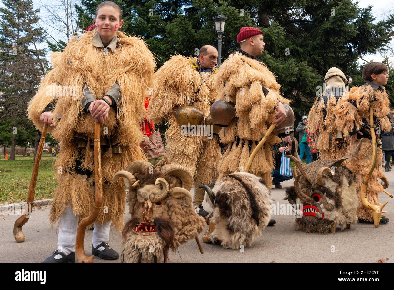 Kukeri dancers with intricate costumes, large bells and masks dancing ...