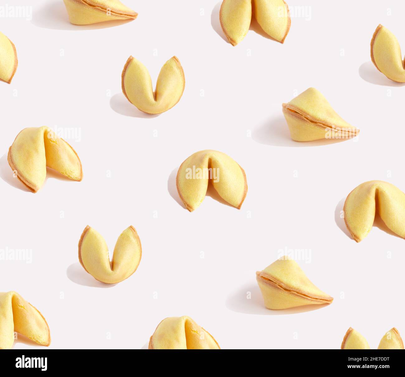 Fortune cookie on a pastel pink background. Chinese tradition. Pattern ...