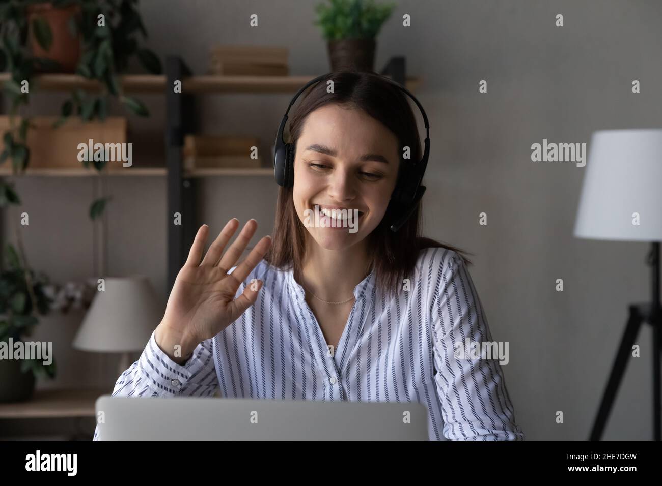 Happy young student girl in headphones with mic Stock Photo - Alamy