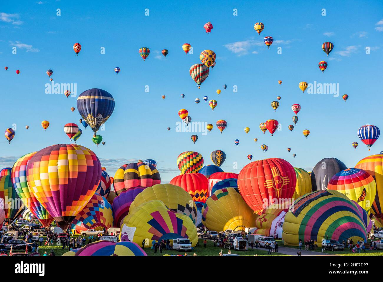 A crowd inflating air balloons during International Hot Air Balloon ...