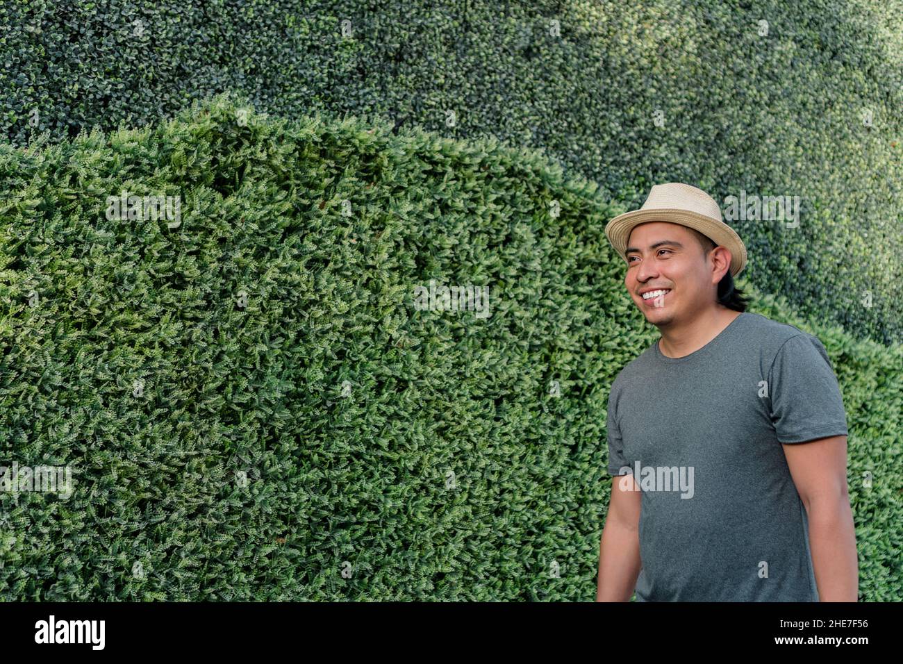 Portrait of a smiling Aboriginal man outdoors with a nature background ...