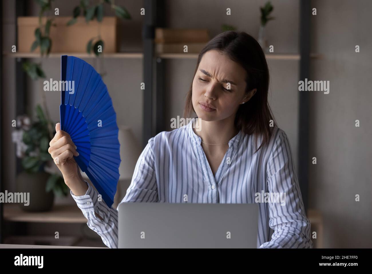 Exhausted office employee suffering from heat, hot stuffy air Stock ...