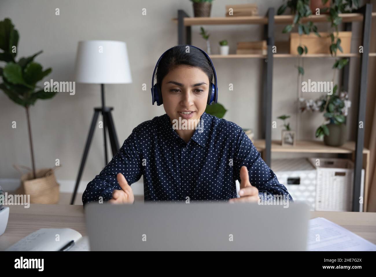 Serious busy Indian support center employee talking to customer Stock ...