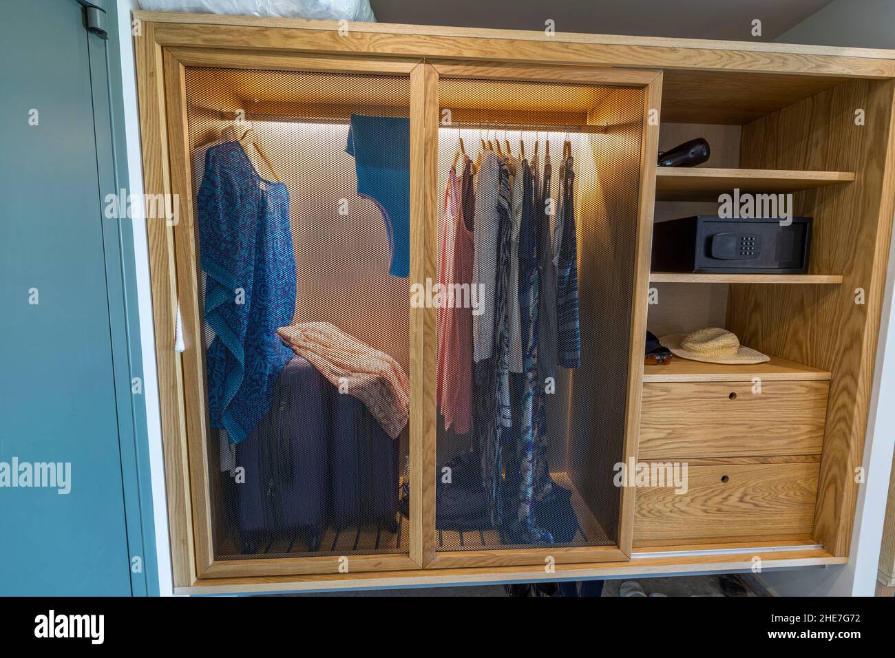 Beautiful view of interior of the clothes in wardrobe and compartment ...