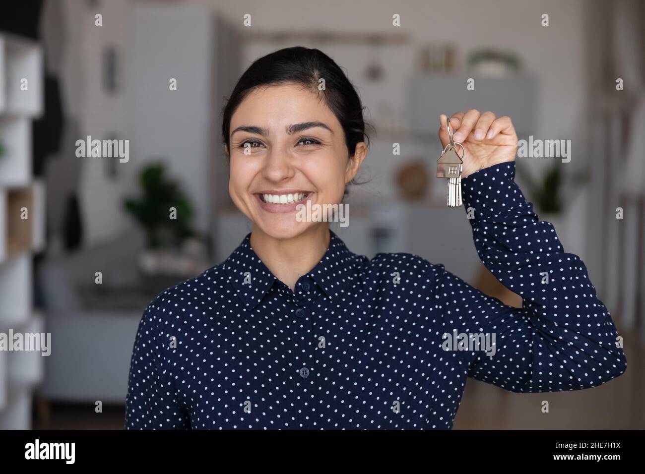 Happy excited Indian new homeowner getting key from home Stock Photo ...