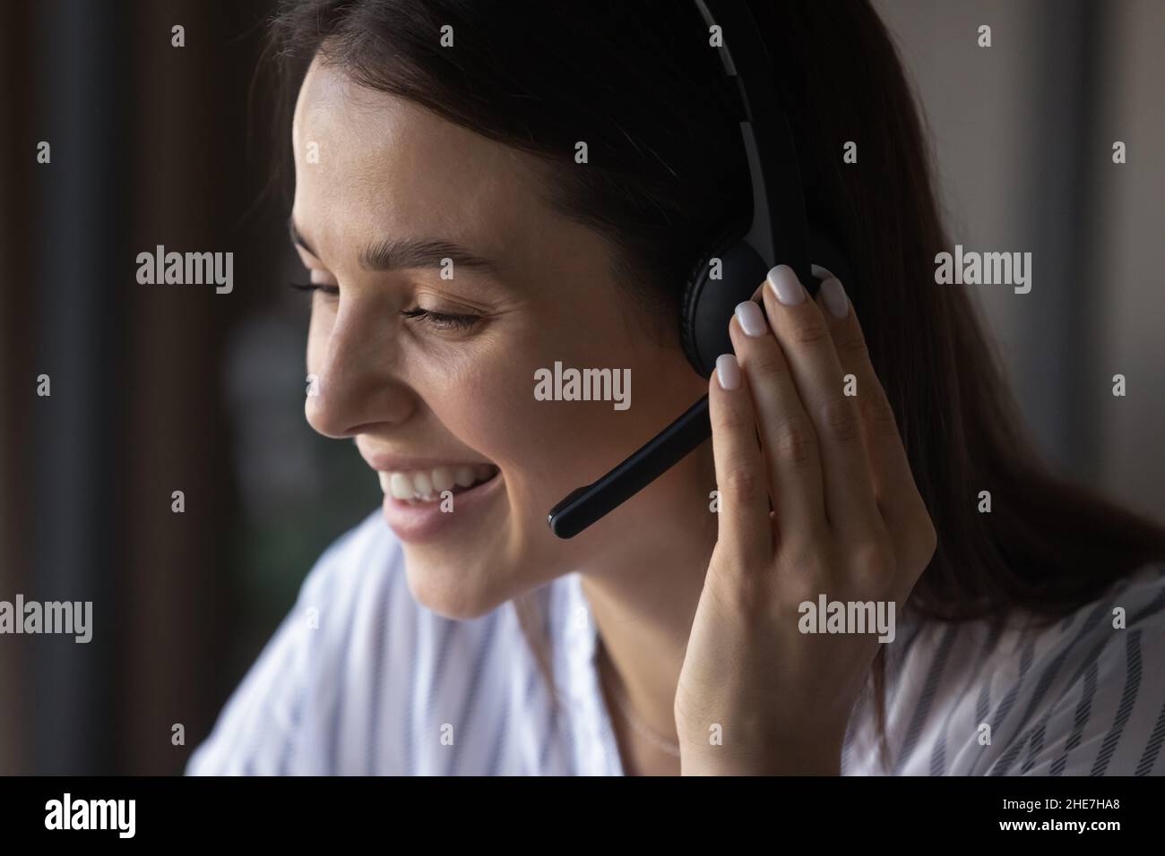 Happy call center office employee in headphones with microphone Stock ...