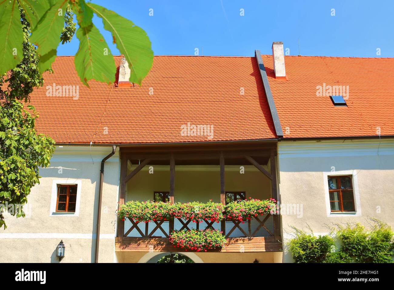 Balcony with bright flowers in medieval Cerveny Kamen (Red Stone Castle ...