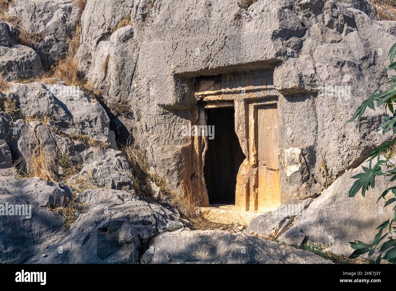 entrance to an ancient stone tomb carved into the rock in Myra Lycian ...