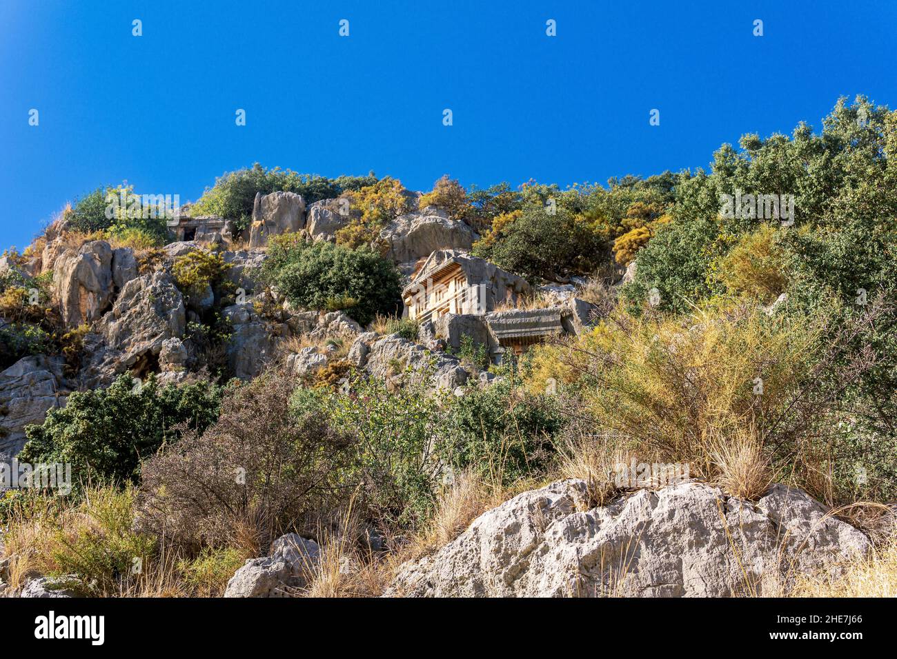 antique ancient greek crypts on the mountainside in Myra Lycian (now ...