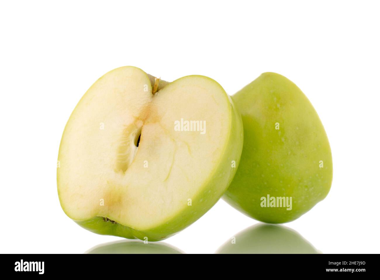 Two halves of a sweet green apple, close-up, isolated on white Stock ...