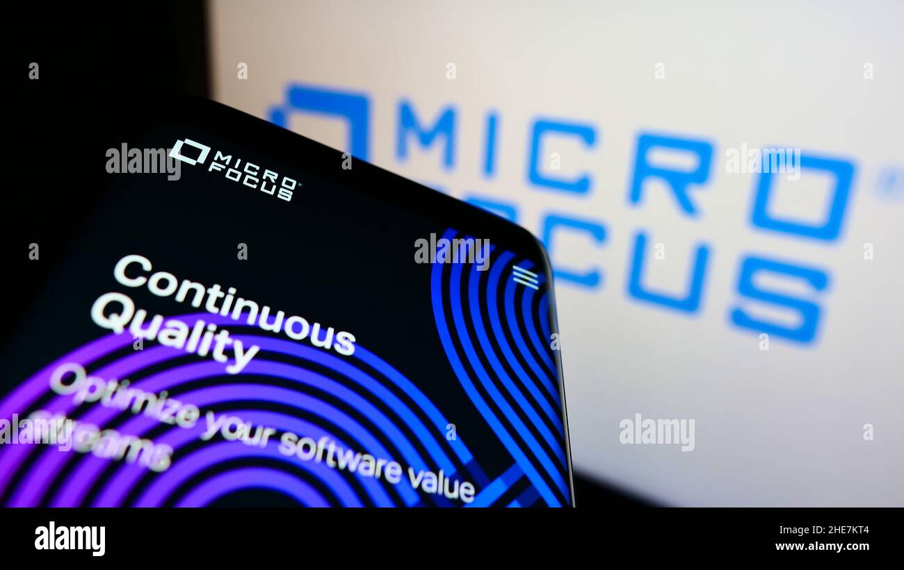 Mobile phone with logo of British software company Micro Focus ...
