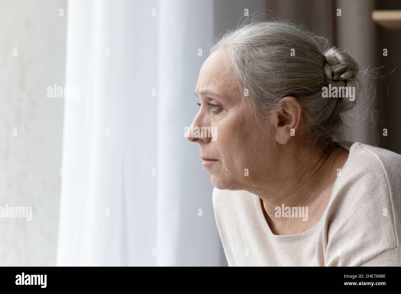 Stressed unhappy old woman thinking of problems at home Stock Photo - Alamy