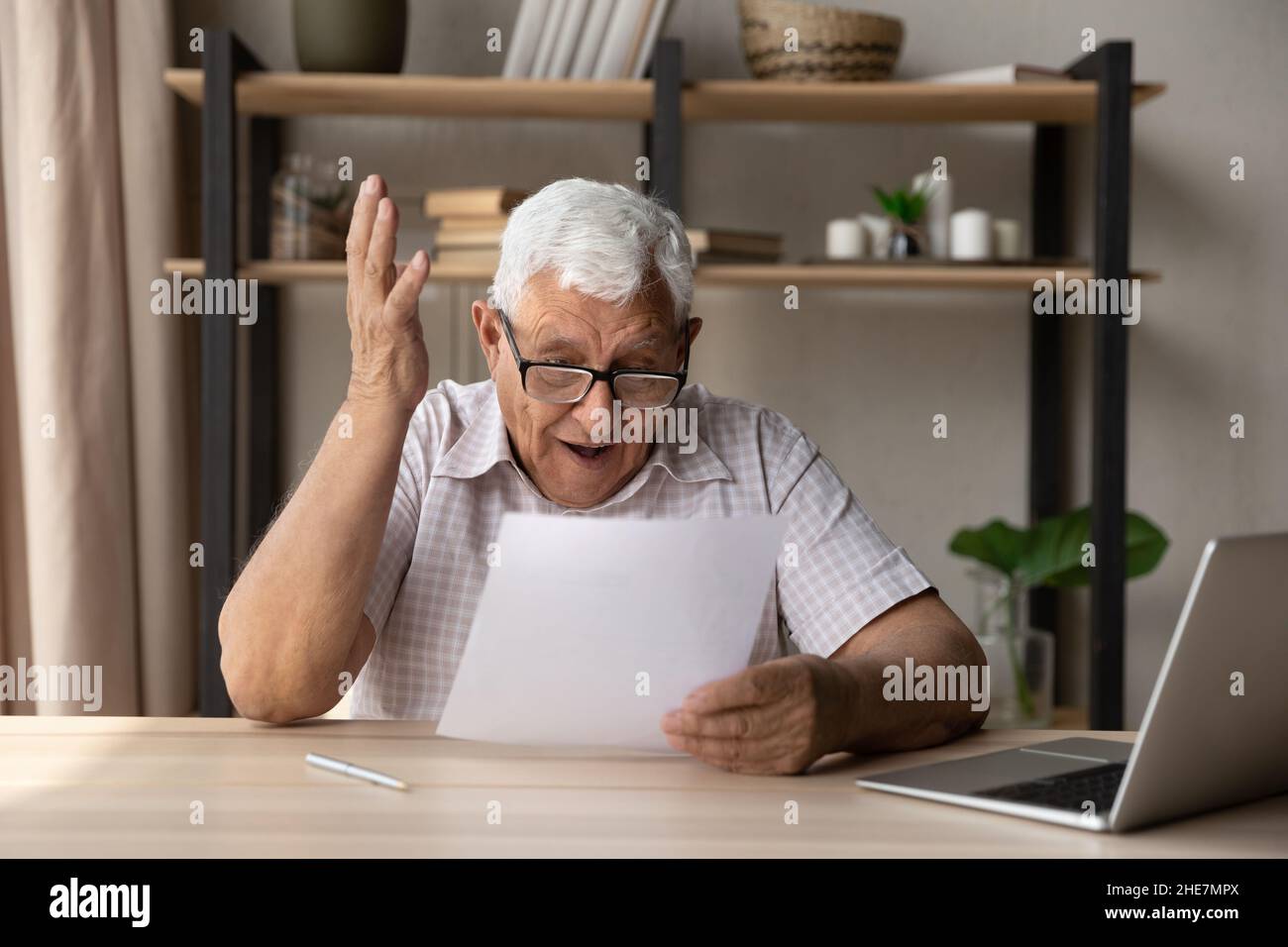 Happy old mature man feeling surprised reading paper document Stock ...