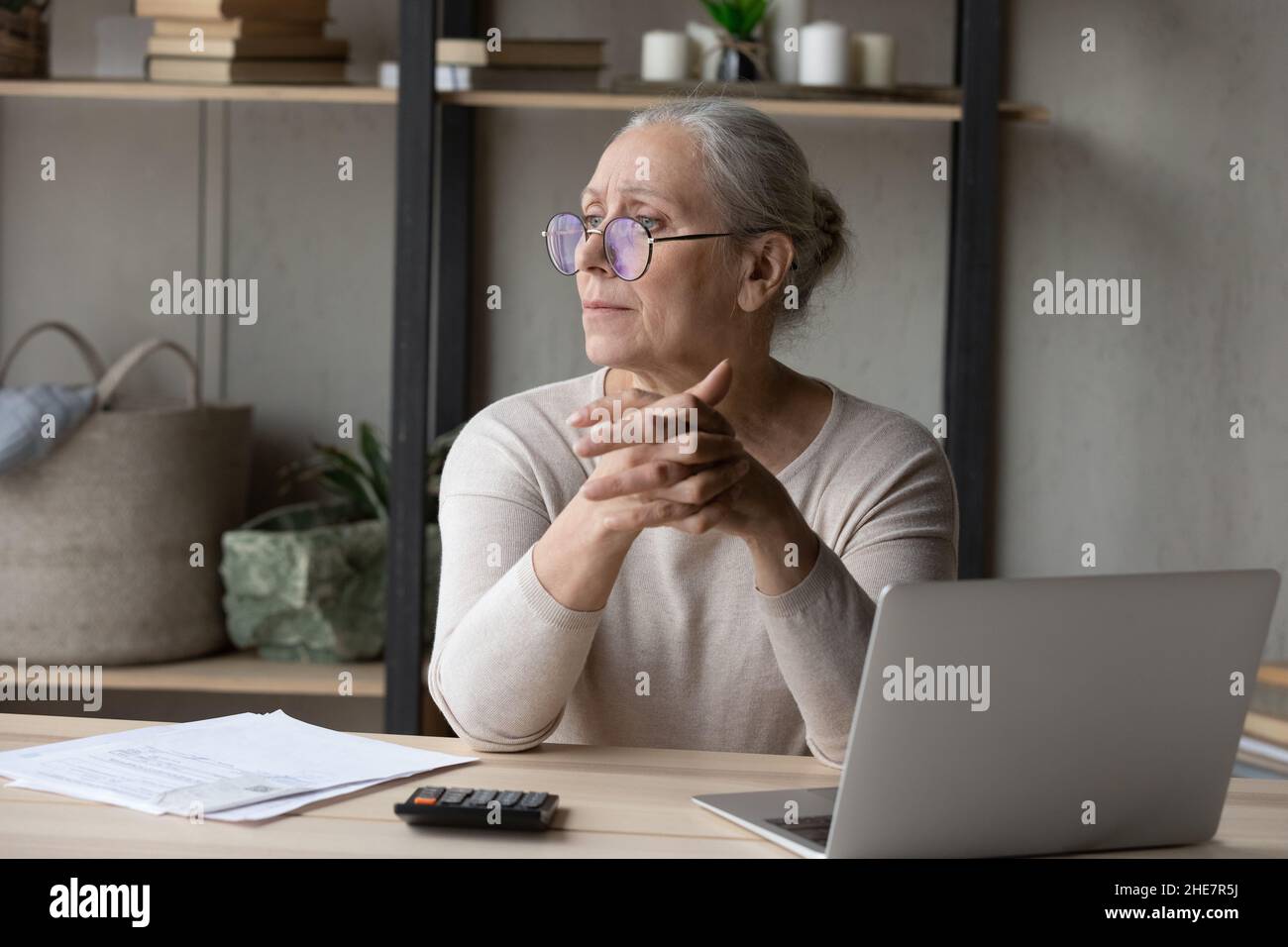 Stressed pensive middle aged woman having financial problems Stock ...