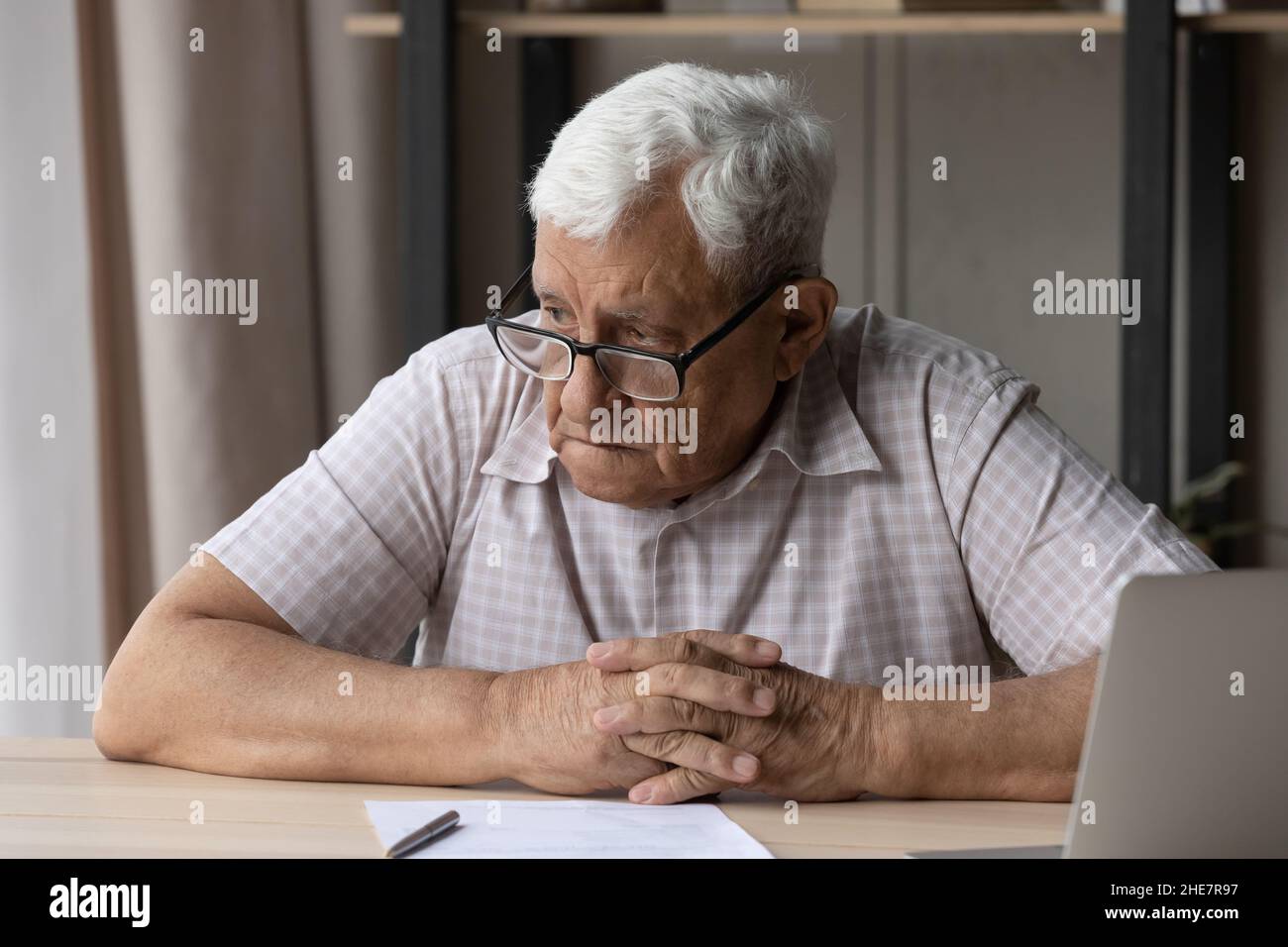 Stressed unhappy old man considering problem solution Stock Photo - Alamy