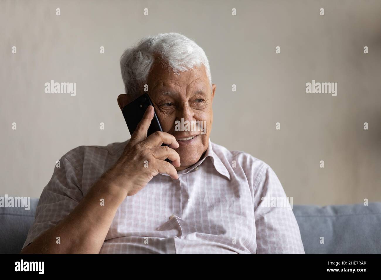 Joyful sincere old man holding cellphone call conversation Stock Photo ...