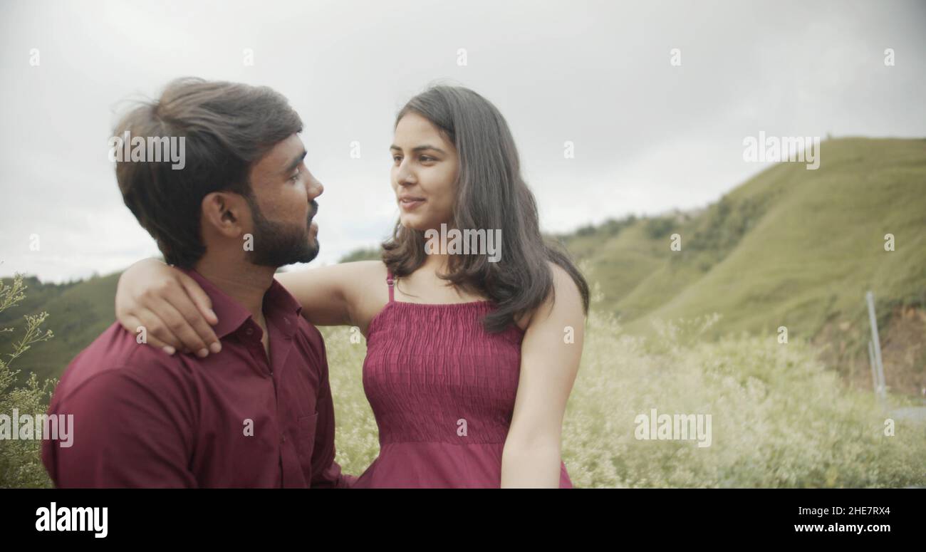 Young Indian couple looking deep into each other's eyes while having a ...