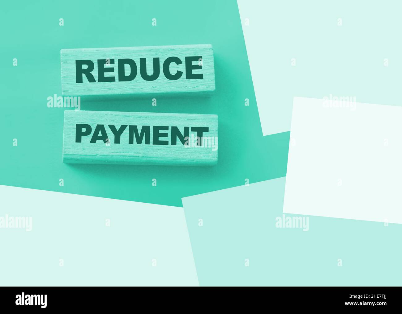 Wooden blocks with the words Reduce payment. Business concept Stock ...