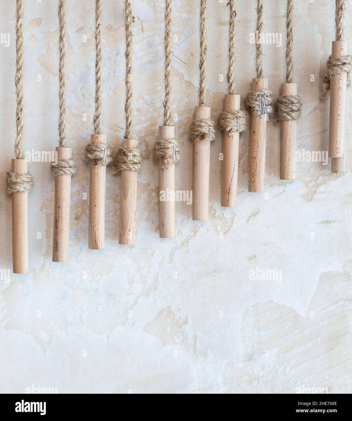 wooden handles hang on a rope, decor Stock Photo - Alamy