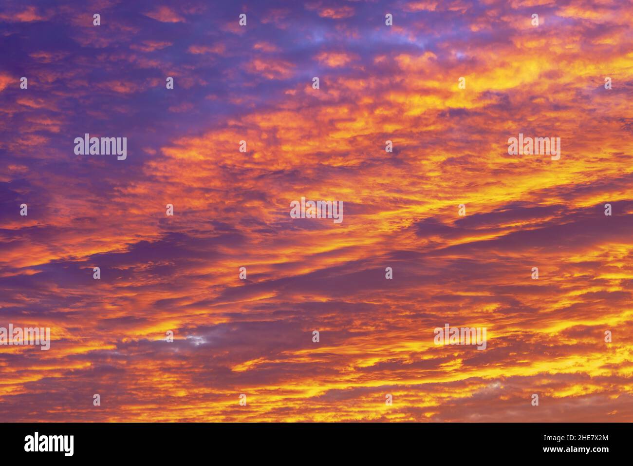 Cloudy sky at sunset, afterglow Stock Photo - Alamy