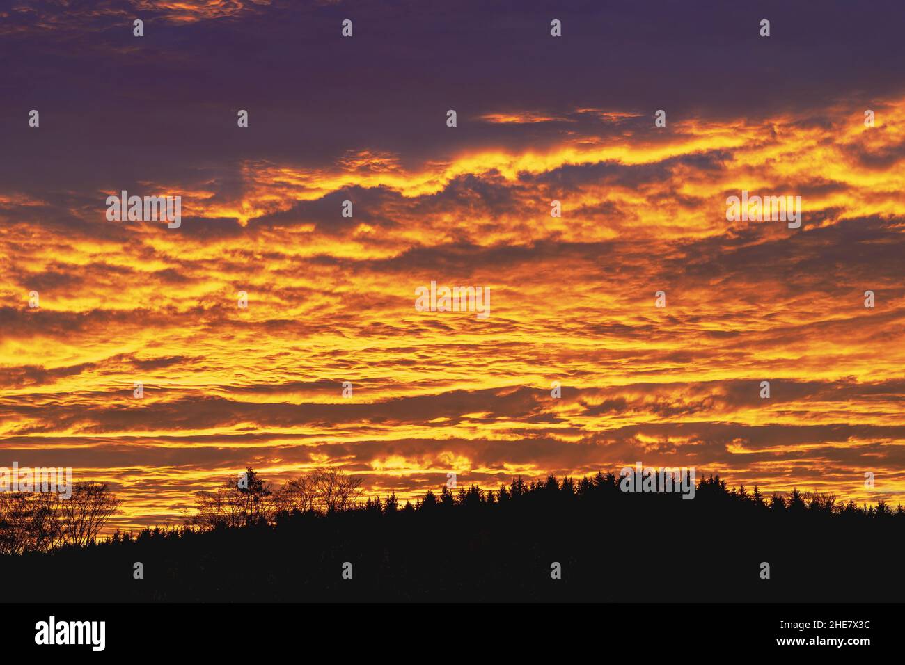 Cloudy sky at sunset, afterglow Stock Photo - Alamy