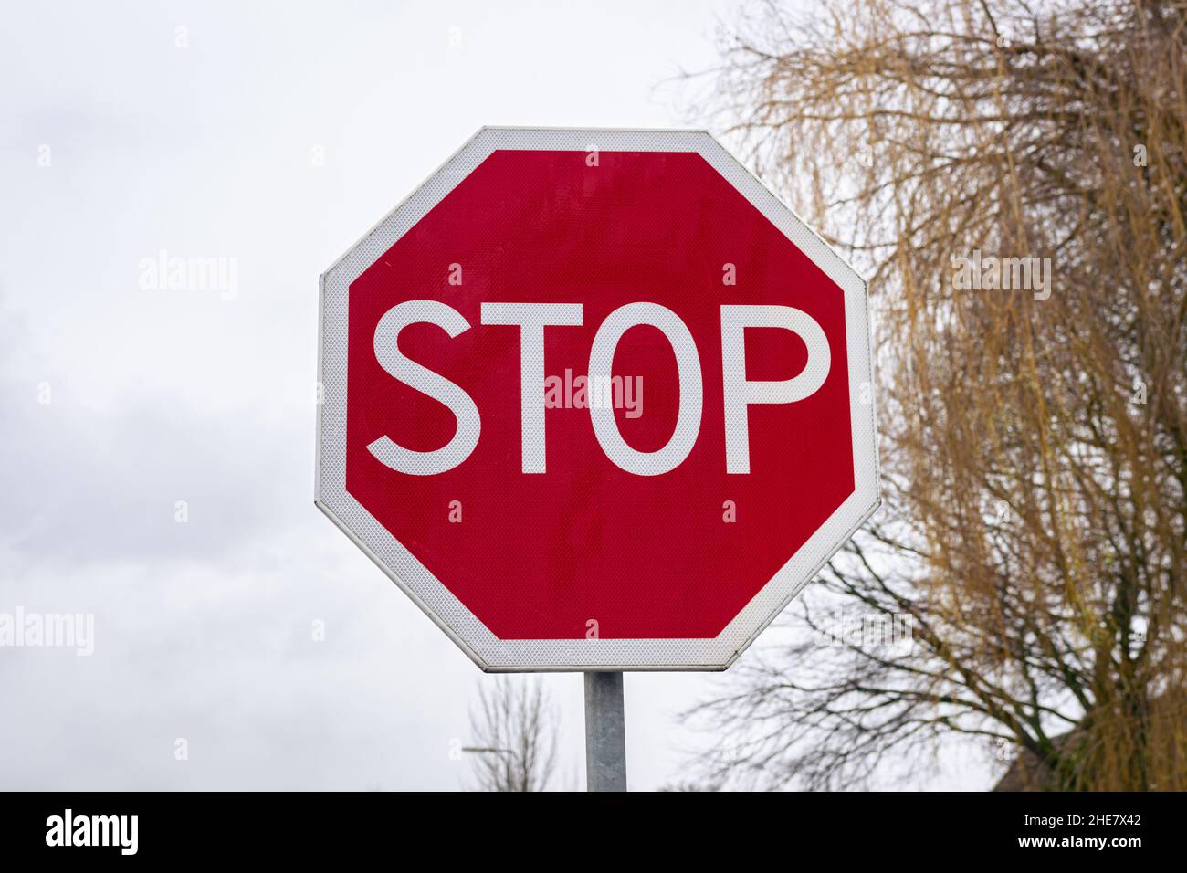 Stop sign along the road Stock Photo - Alamy