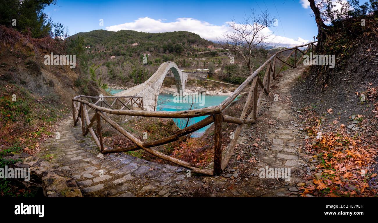 The great arched stone bridge of Plaka on Arachthos river, Tzoumerka ...