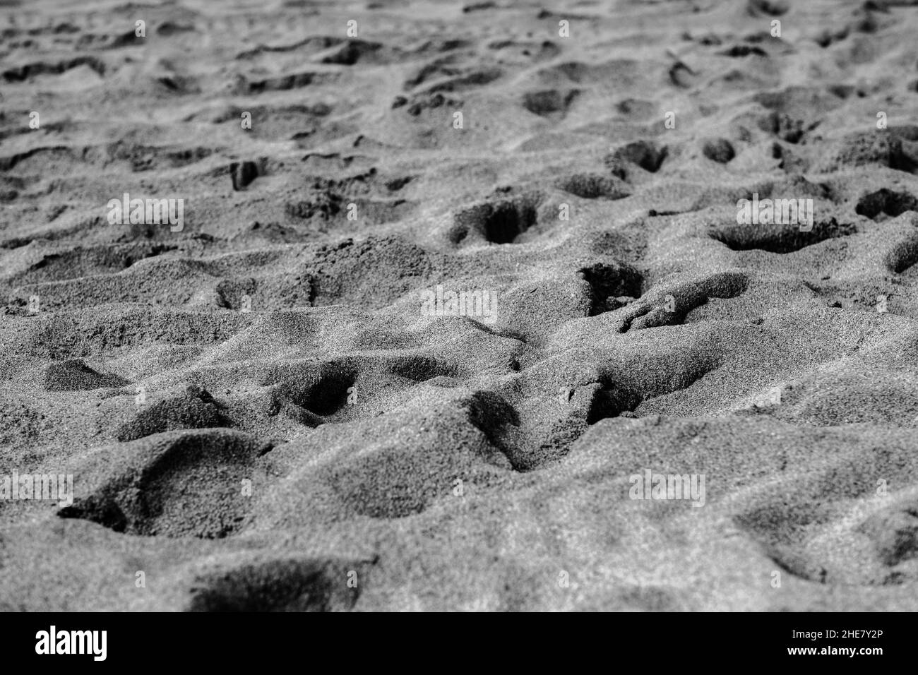 Closeup shot of gray sand at the beach of Capetown in South Africa ...